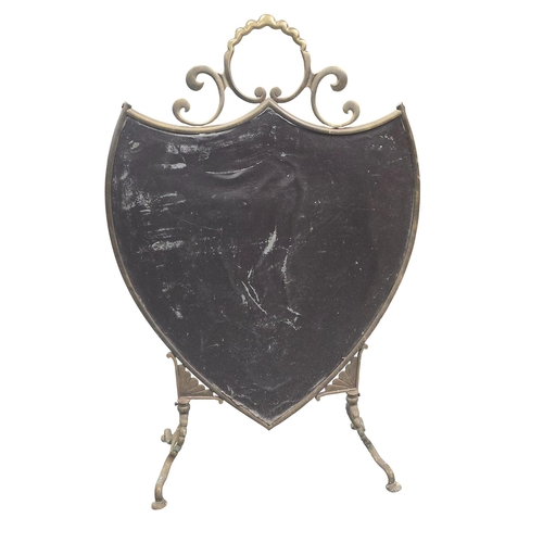 A Victorian brass framed shield shaped mirrored firescreen , 51cms wide.