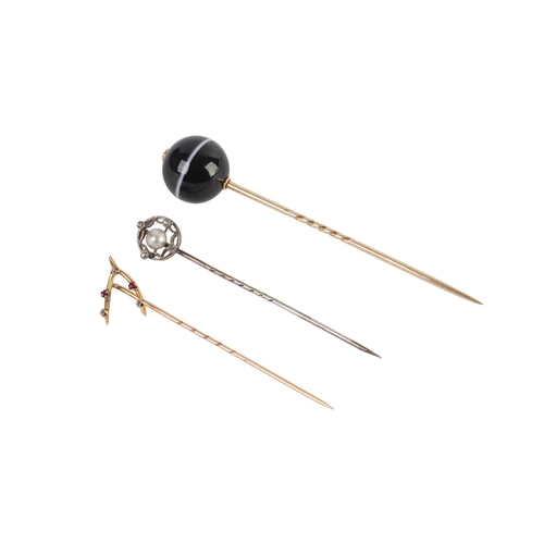 A 15ct gold wishbone stick pin set with rubies and diamonds, 1.5g ...