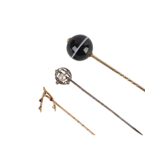 A 15ct gold wishbone stick pin set with rubies and diamonds, 1.5g ...