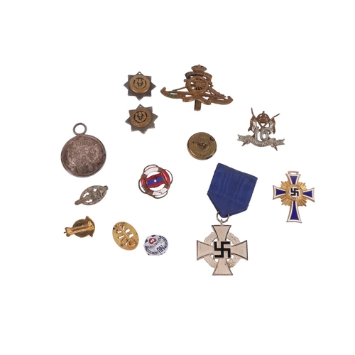 A WWII Third Reich Faithful Service medal; together with a WWII Third ...