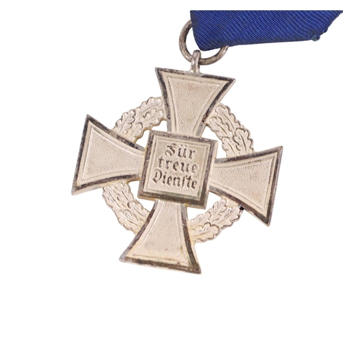 A WWII Third Reich Faithful Service medal; together with a WWII Third ...