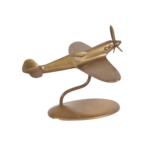 A brass model of a spitfire / hurricane, 17cms long.