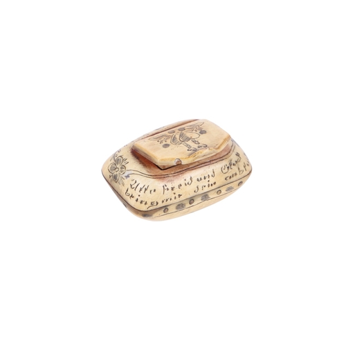 A small bone scrimshaw snuff box decorated with flowers and a motto, 4 ...