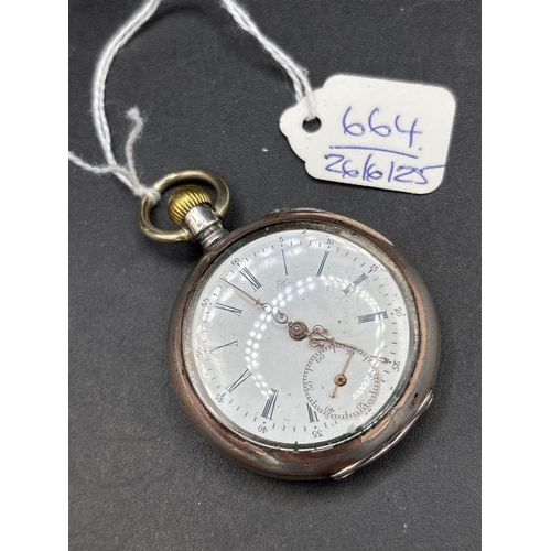 A large silver gilt pocket watch with seconds dial