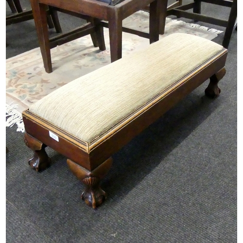 A MAHOGANY AND UPHOLSTERED LONG FOOTSTOOL