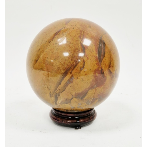 Large polished agate jasper ball, approximately 16cm diameter on wooden ...