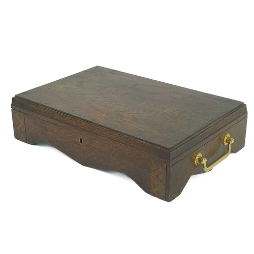 An oak hinge-lidded pocket watch storage box. With 24 fitted ...