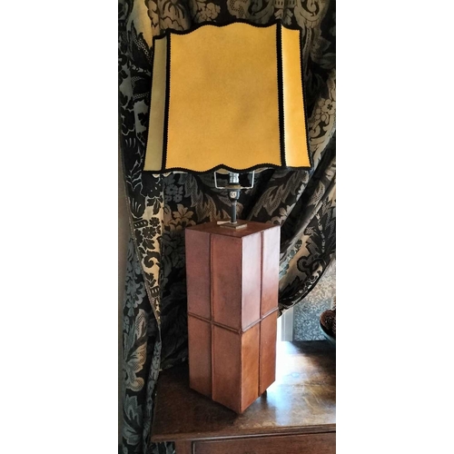 A contemporary leather effect table lamp. With 'stitched' decoration ...