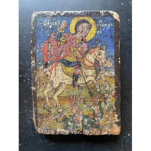 A Greek painted icon. St George slaying the dragon, on a pine panel ...