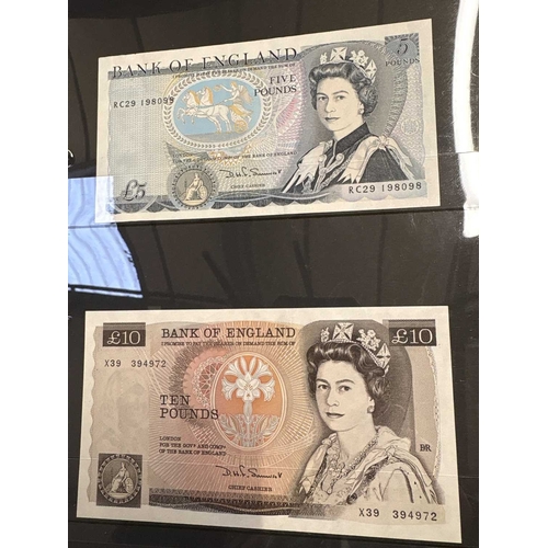 Collection of mostly Great Britain banknotes. A red folder containing ...