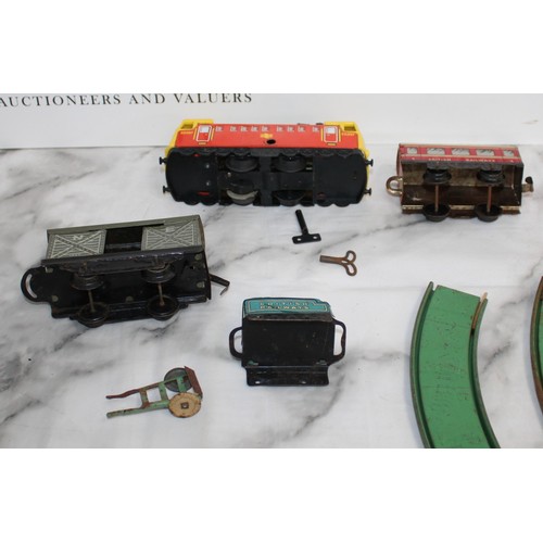 Vintage Tin Train Set Including Track, Windup Locomotive, Carriages And ...