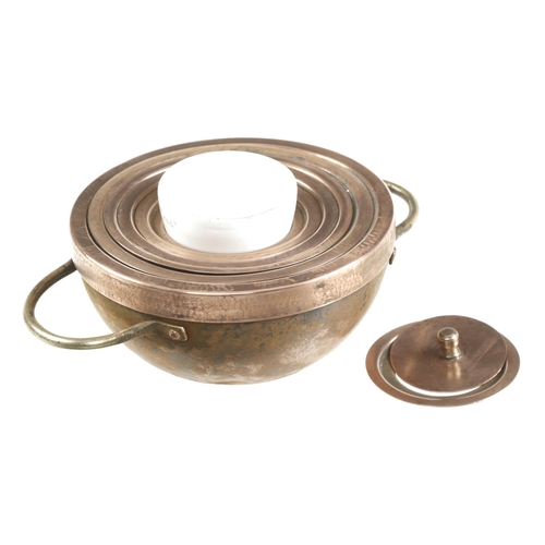 An early copper water bath with set of rings to take different crucible ...