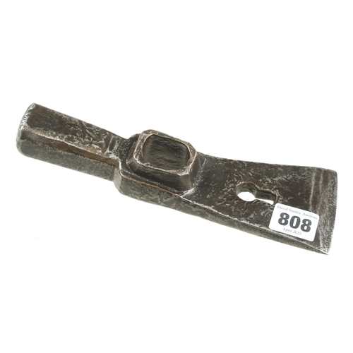 A primitive adze head with hammer pole G