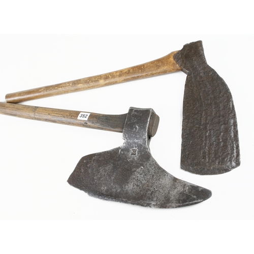 A long handled axe marked AE and another pitted G-