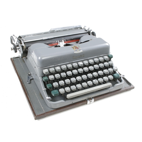 An IMPERIAL "Good Companion" portable typewriter with instructions in ...
