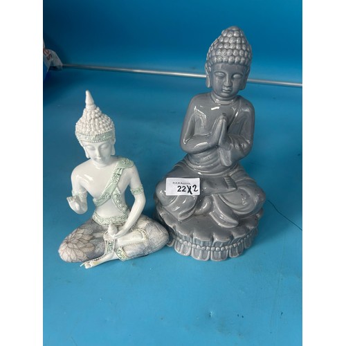 Pottery Buddha and a Resin Buddha