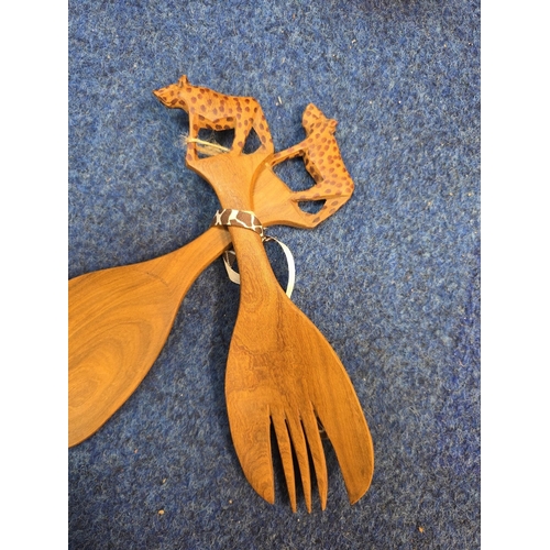 A Pair of Hand Carved African Wooden Cheetah/Leopard Salad Servers