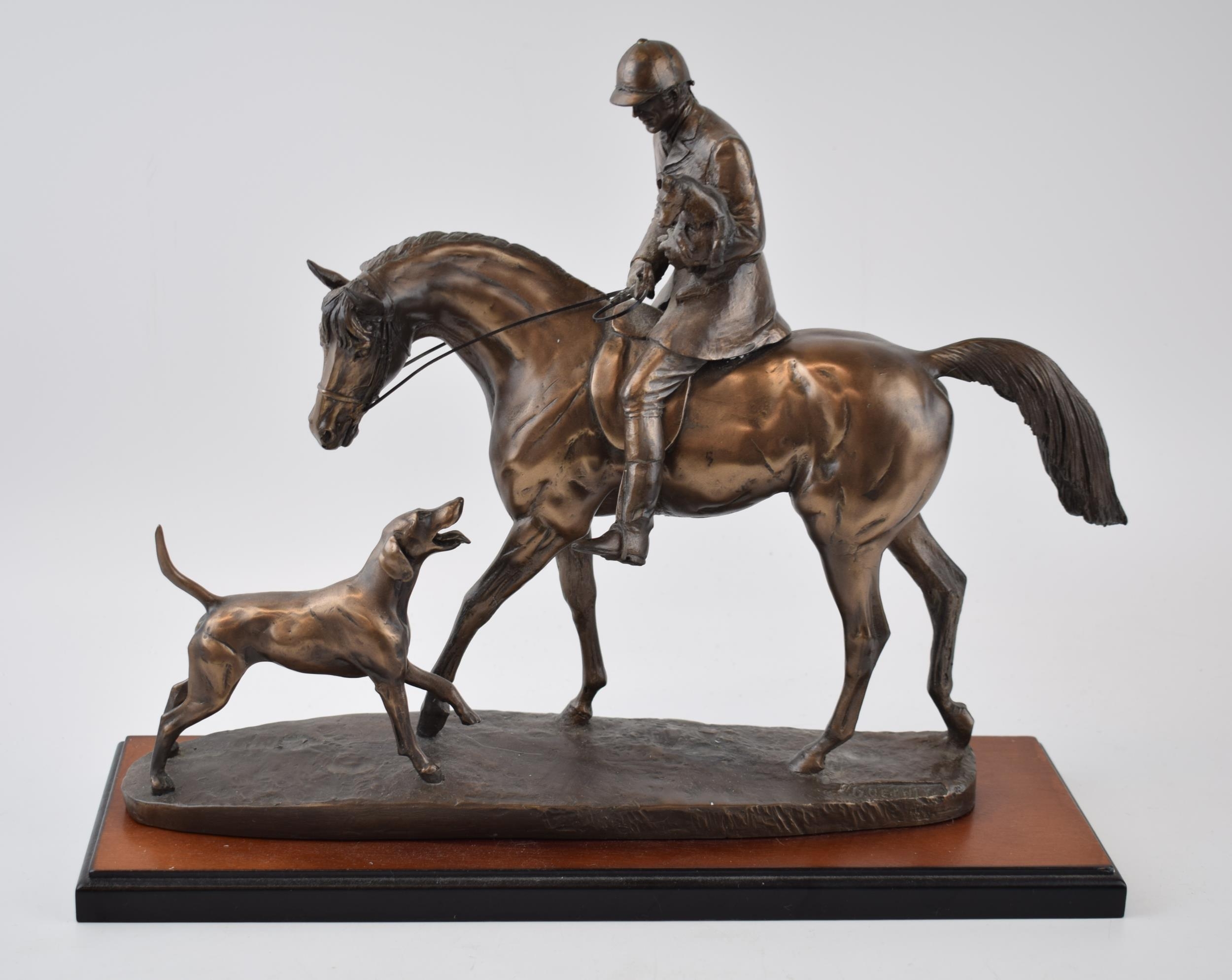 David Geenty: a bronzed resin huntsman scene on wooden base, 38cm wide.