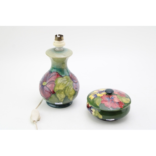 Moorcroft lamp base a/f in the Clematis pattern together a lidded jar ...