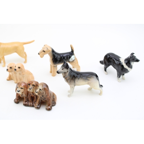 Six Beswick small dogs to include a Border Collie, an Alsatian and ...