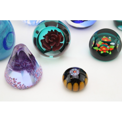 A collection of glass paperweights to include Caithness purple pyramid ...