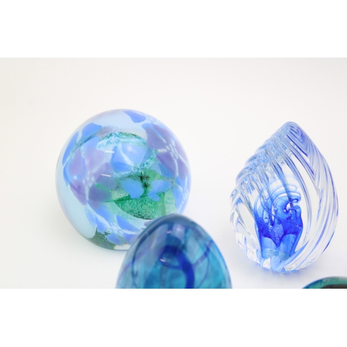 A collection of glass paperweights to include Caithness purple pyramid ...