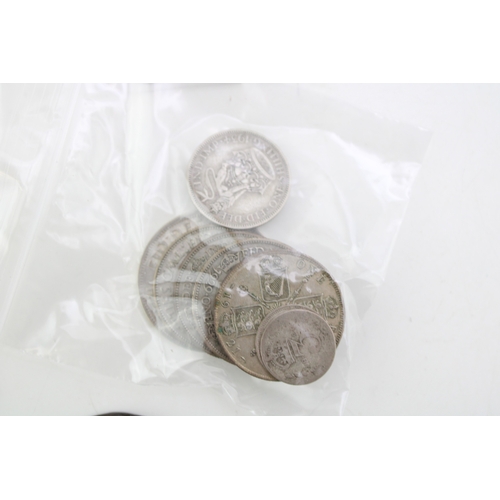 A collection of coins to include 1/2 silver Uk coinage (67.5g), full ...