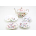 A Hilditch teapot with issues, with a dish, 21cm diameter, with three ...