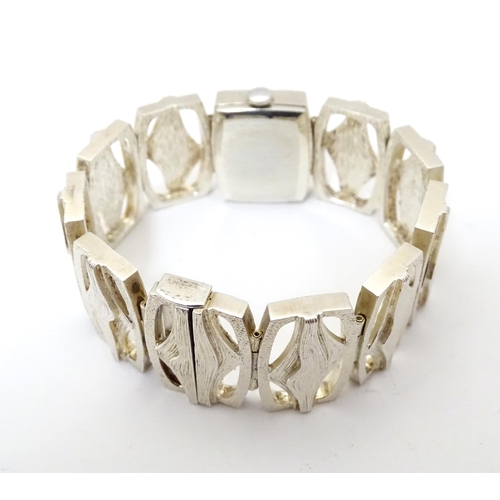 A mid - century modernist watch by David Shackman and Sons