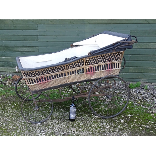 A large Victorian pram / spinal / invalid carriage. The wicker ...