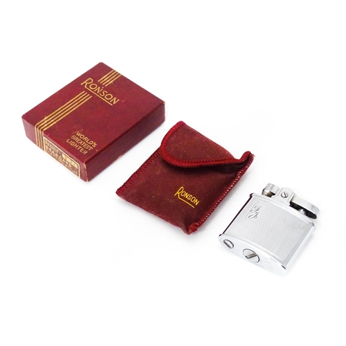 A mid 20thC Ronson Standard pocket lighter with original box and slip ...