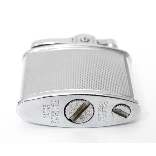 A mid 20thC Ronson Standard pocket lighter with original box and slip ...