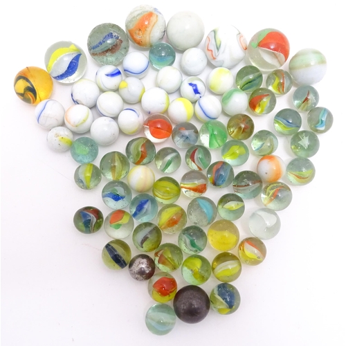 A quantity of assorted glass marbles, many with colours twists. Largest ...