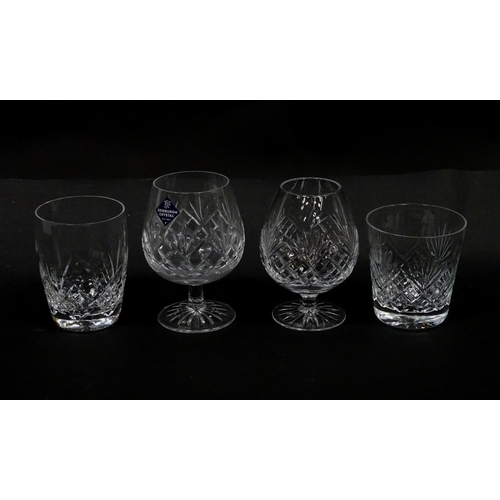 A quantity of cut crystal drinking glasses, comprising champagne flutes ...