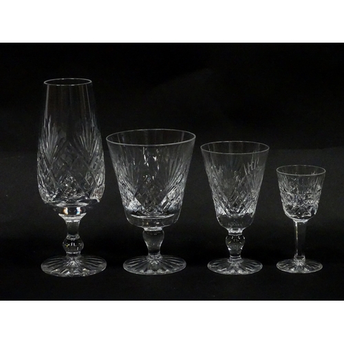 A quantity of cut crystal drinking glasses, comprising champagne flutes ...