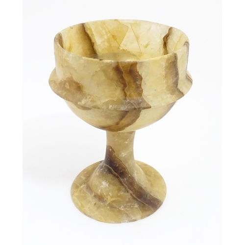 A carved stone goblet with banded agate style decoration. Approx. 7 3/4 ...