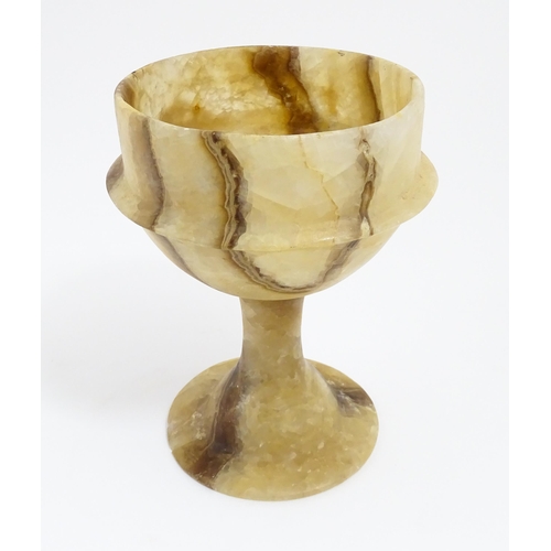 A carved stone goblet with banded agate style decoration. Approx. 7 3/4 ...