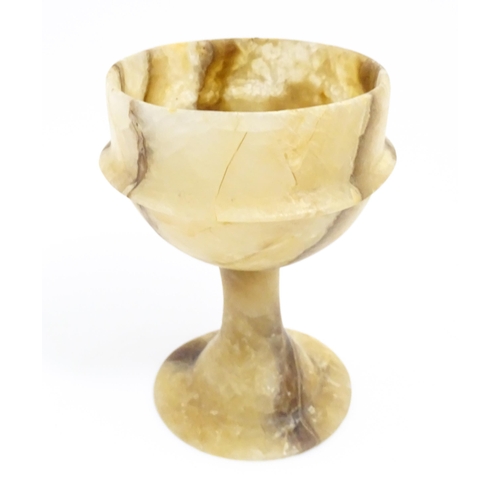A carved stone goblet with banded agate style decoration. Approx. 7 3/4 ...