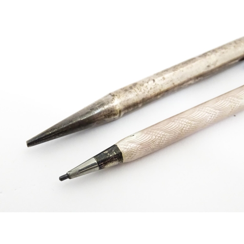 Two silver propelling pencils, one with guilloche enamel decoration ...