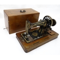 An early 20thC Frister & Rossmann hand crank sewing machine with floral ...