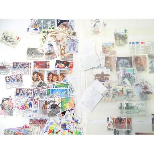 A quantity of 19th and 20thC postage stamps affixed within five albums ...