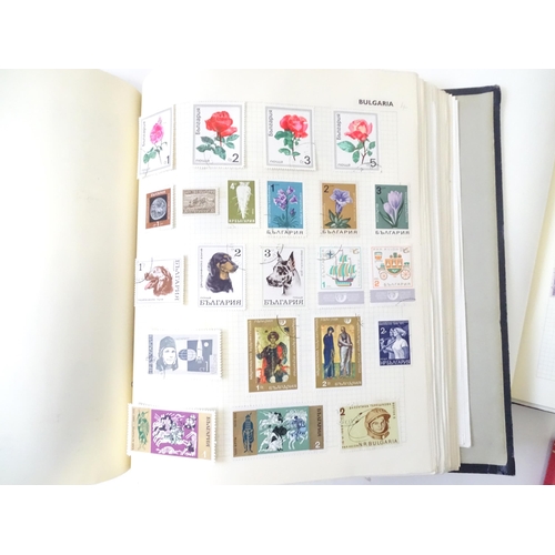 A quantity of 19th and 20thC postage stamps affixed within five albums ...