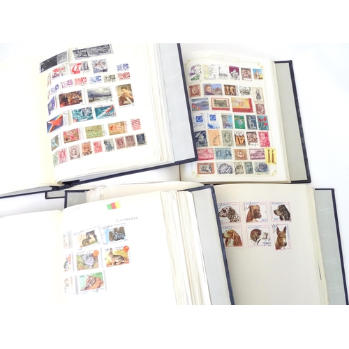 A quantity of 19th and 20thC postage stamps affixed within five albums ...