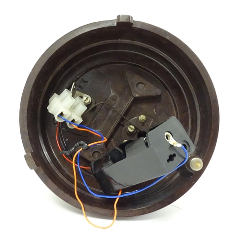 A Tempex electric clock mounted on a Bakelite base with chrome fitting ...