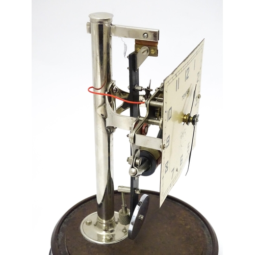 A Tempex electric clock mounted on a Bakelite base with chrome fitting ...