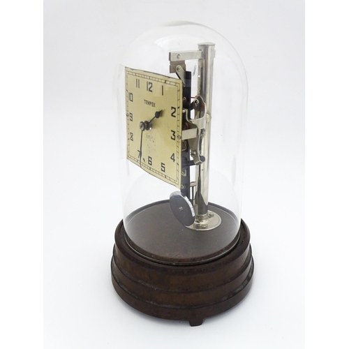 A Tempex electric clock mounted on a Bakelite base with chrome fitting ...