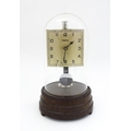 A Tempex electric clock mounted on a Bakelite base with chrome fitting ...