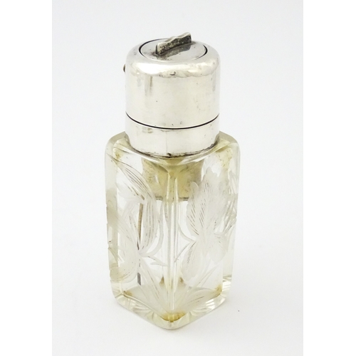 A glass atomiser with sterling silver mounts. Together with a cut glass ...