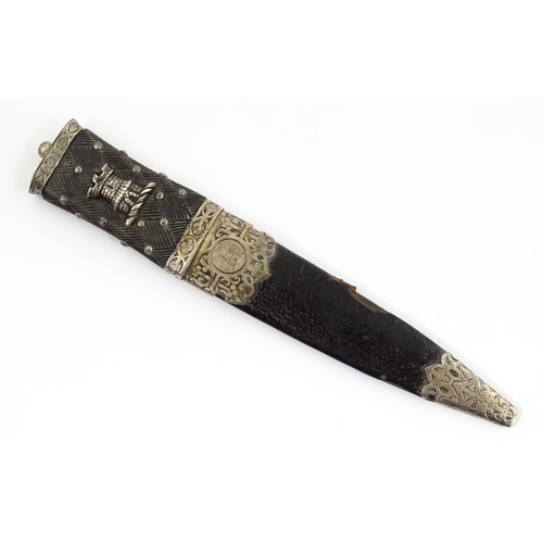 A 19thC Scottish Sgian Dubh dagger, the carved ebony hilt and leather ...