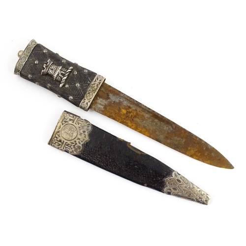 A 19thC Scottish Sgian Dubh dagger, the carved ebony hilt and leather ...